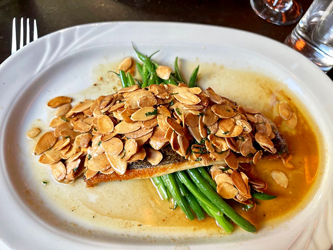 Trout amandine where the fish and almonds have formed a delicious alliance to conquer your taste buds with buttery finesse.