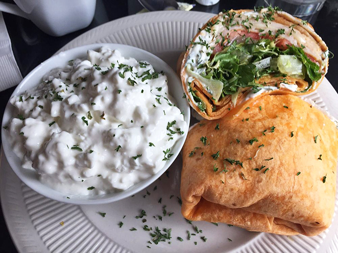 This wrap isn't just lunch &ndash; it's edible architecture with layers of flavor and that side of creamy potatoes is stealing the spotlight.