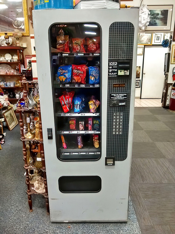 Even the snack machine is vintage! This retro vending relic stands ready to fuel your antiquing marathon with perfectly preserved packages.