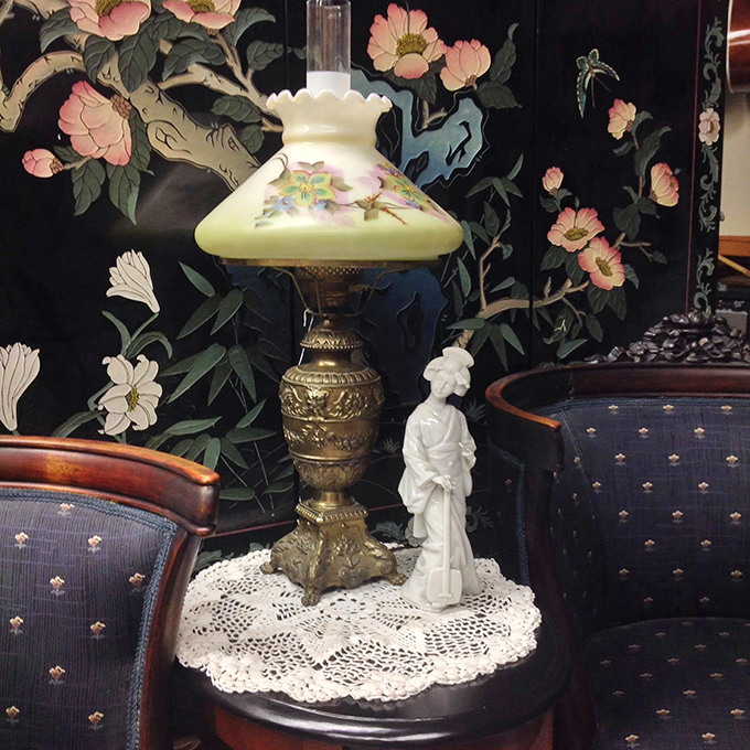 That vintage lamp isn't just lighting&mdash;it's ambiance with history. The brass base and painted shade have illuminated countless family dinners.