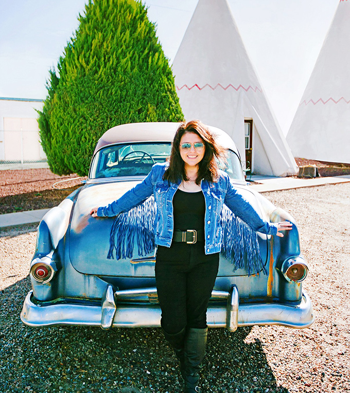 Visitors can't resist posing with classic cars - it's like stepping into a 1950s time capsule. 