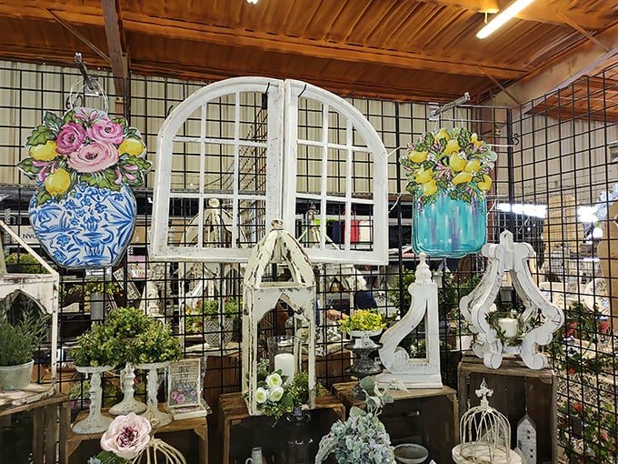 Shabby chic meets farmhouse fantasy in this architectural salvage booth. That white arched window frame is calling to someone's Pinterest board right now.