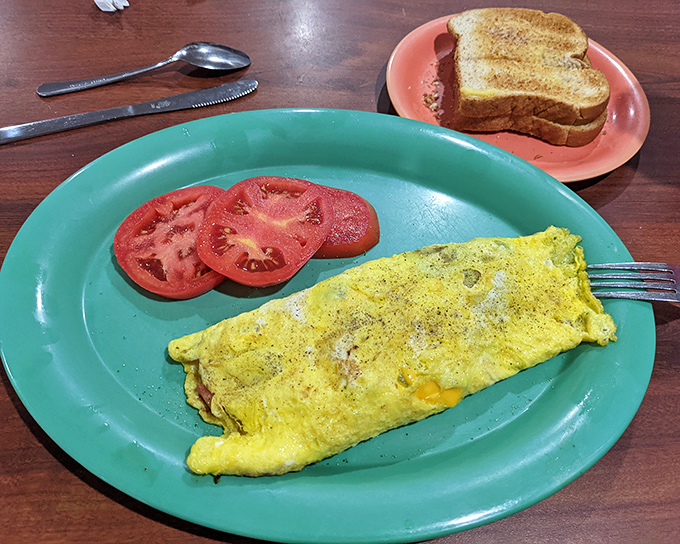 A Western omelet that puts hotel breakfast buffets to shame. Those fresh tomato slices add just enough virtue to justify dessert afterward.