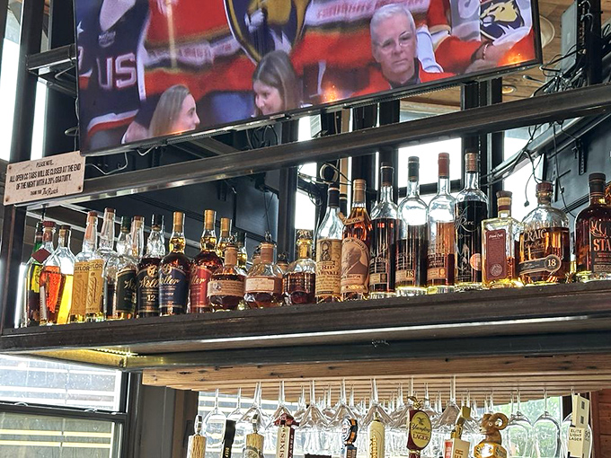 The whiskey collection gleams like liquid amber treasure&mdash;each bottle a story waiting to be poured and savored.