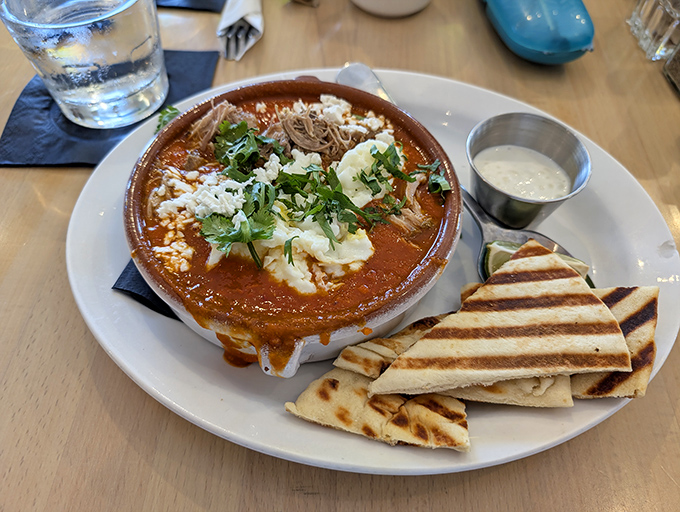 Shakshuka that demands to be photographed before eaten. White beans and carnitas prove that fusion isn't just a buzzword&mdash;it's breakfast evolution.