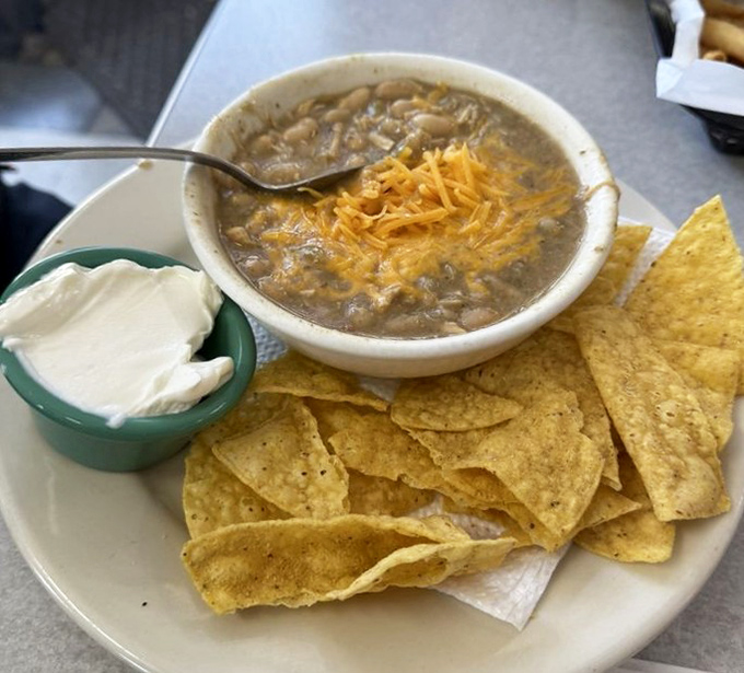 White chicken chili that warms the soul and makes winter bearable. Add cheese, grab those chips, and forget your troubles for a while.