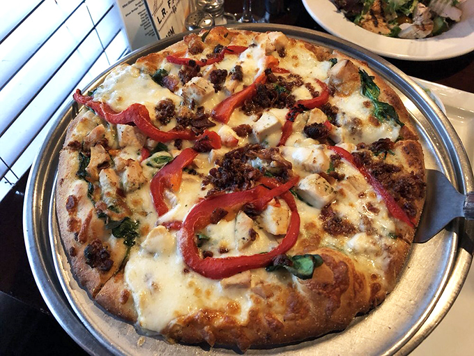 This white pizza with roasted red peppers doesn't need traditional sauce to make its point&mdash;it's confident in its cheesy, vegetable-topped excellence.