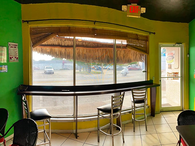 The thatched window treatment isn't just decor&mdash;it's a frame for daydreaming about beaches while you wait for food that will transport you there anyway.