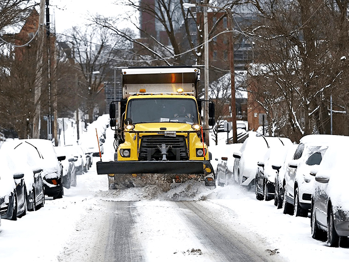 Winter in Ohio means snow plows become the most popular vehicles in town. That yellow knight in shining armor rescues neighborhood streets from icy isolation.