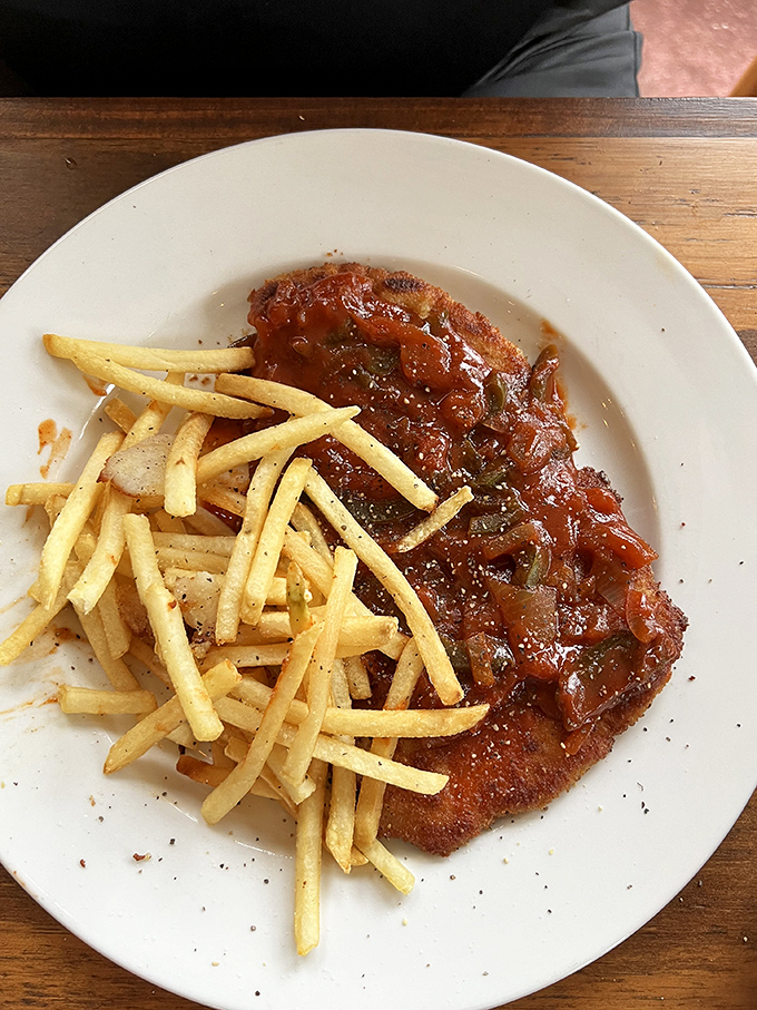 This schnitzel, smothered in zesty bell pepper sauce alongside golden fries, makes you wonder why you ever settled for chicken nuggets.