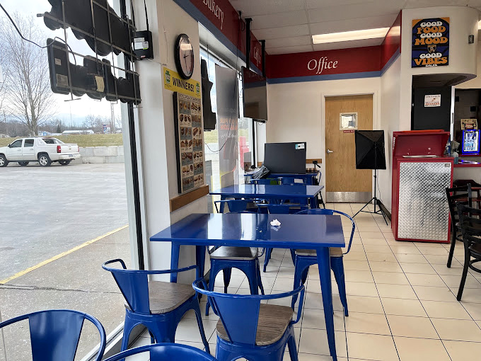 Blue tables add a pop of color to the no-frills dining area. The real artwork here is what arrives on your plate.