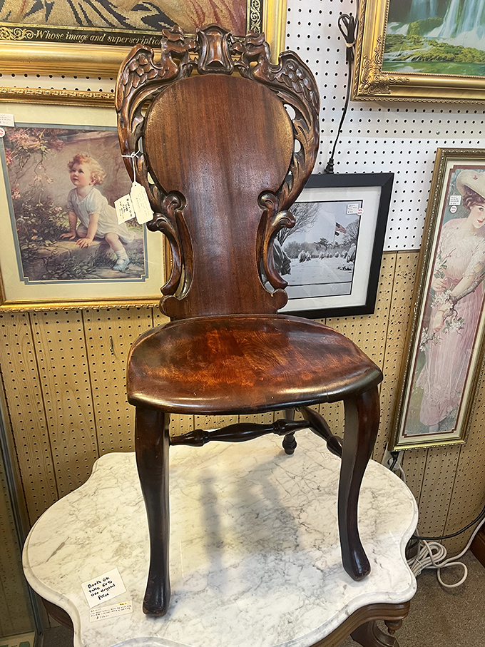 This carved wooden chair isn't just furniture&mdash;it's functional sculpture. Someone important once sat here, or at least someone who thought they were important.