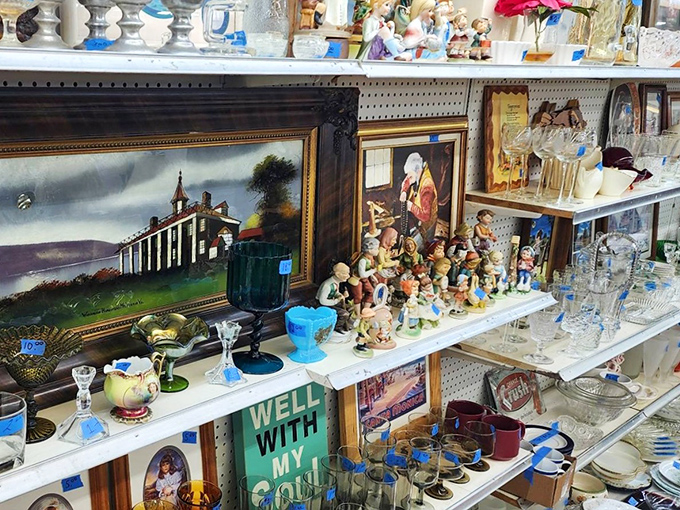 A treasure hunter's dream shelf&mdash;where Mount Vernon paintings neighbor Hummel-inspired figurines and depression glass catches the light.