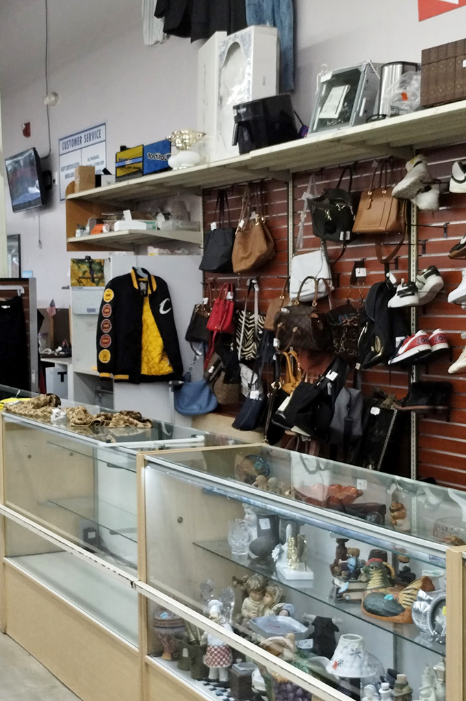 The accessories wall—where designer bags occasionally hide in plain sight, waiting for someone who recognizes their true value.