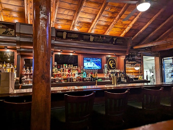 The bar gleams with amber bottles and polished wood&mdash;a place where Manhattan cocktails meet wilderness lodge in perfect harmony.