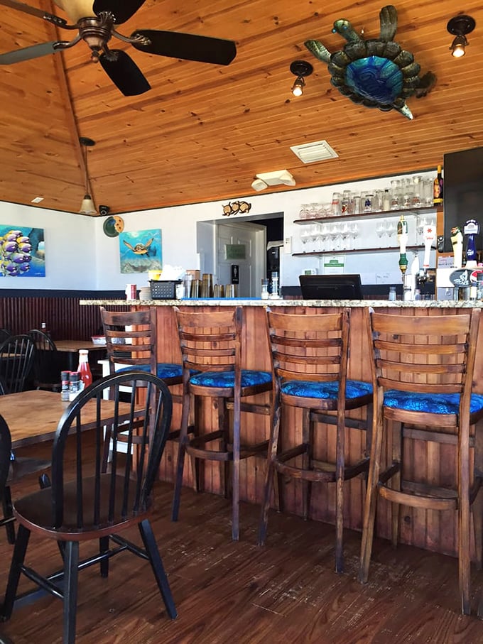 A bar that perfectly captures the "coastal casual" vibe, where wooden stools and ceiling fans tell you to relax&mdash;you're on Florida time now.