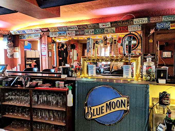 A bar adorned with license plates from visitors far and wide&mdash;proof that good barbecue is worth crossing state lines to experience.