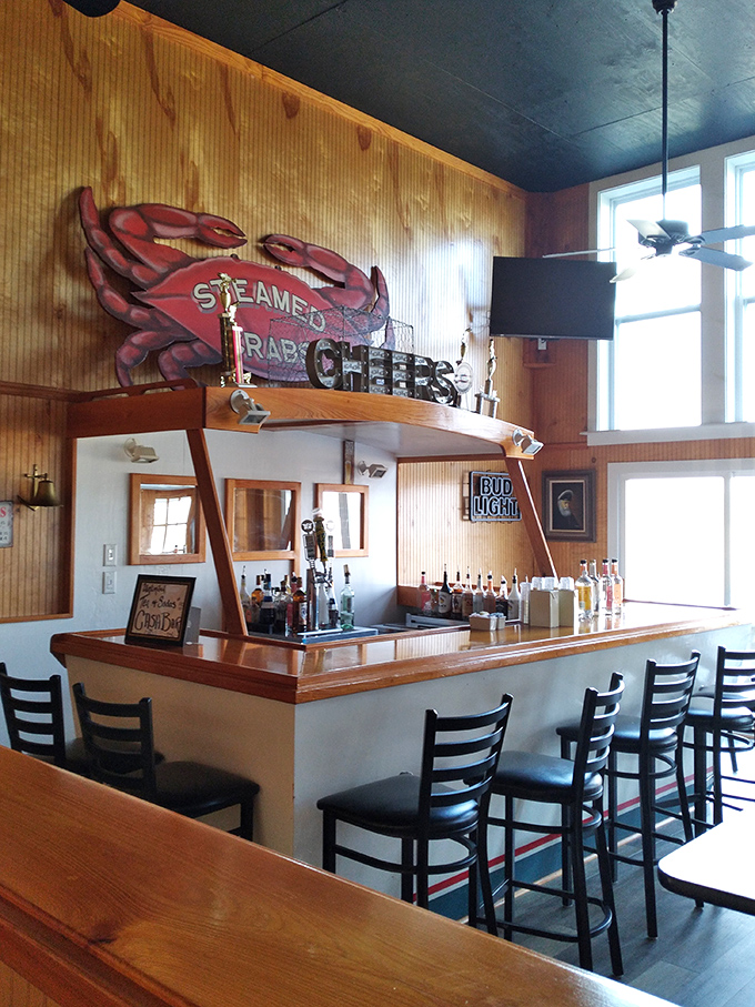 The bar area, complete with that magnificent crab mural, is where locals share fishing tales that grow taller with each round.