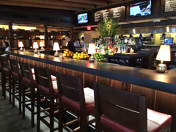 A bar stocked with promise and possibility, where fresh citrus stands ready for its supporting role in your evening's libation.