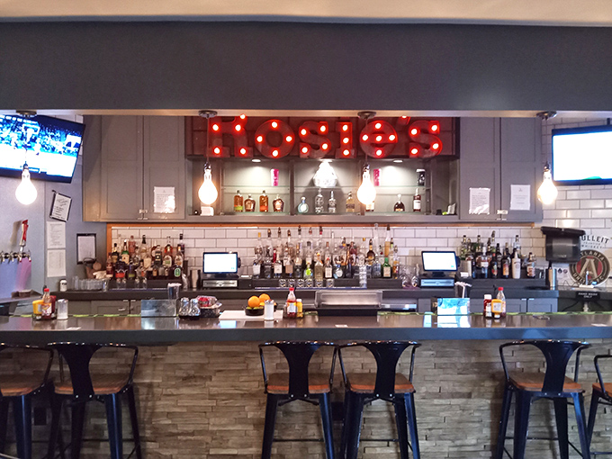 The bar sign glows like a beacon of hope for those who believe brunch without cocktails is just a sad, late breakfast.