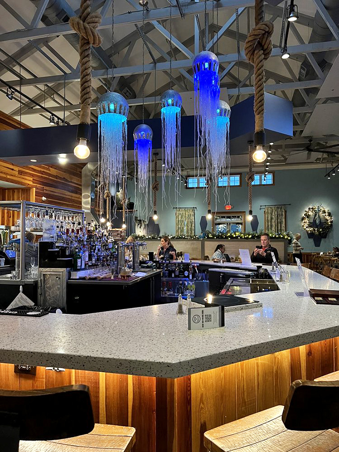 Jellyfish-inspired lighting casts an ethereal blue glow over the bar. It's like drinking in an upscale underwater kingdom, minus the need for scuba gear.