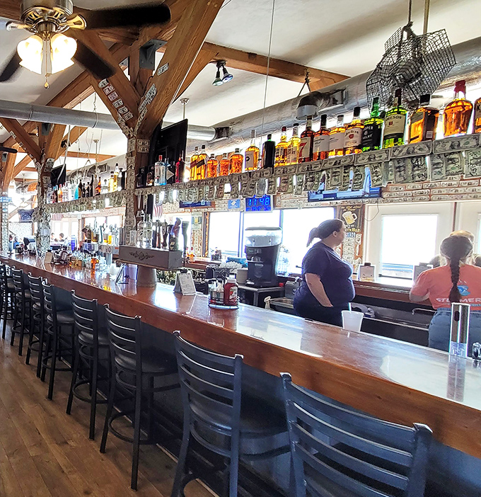 A bar that understands the importance of good lighting, cold drinks, and dollar bills stapled to wooden beams for reasons unknown.