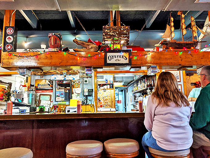 The bar beckons with promises of cold drinks and warm conversation in this nautical haven.