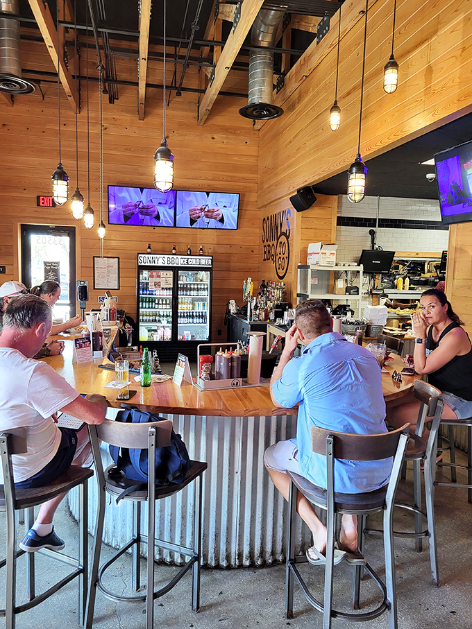 The bar area where strangers become friends over shared appreciation of smoke rings and sauce varieties. Those industrial lights have witnessed many barbecue epiphanies.