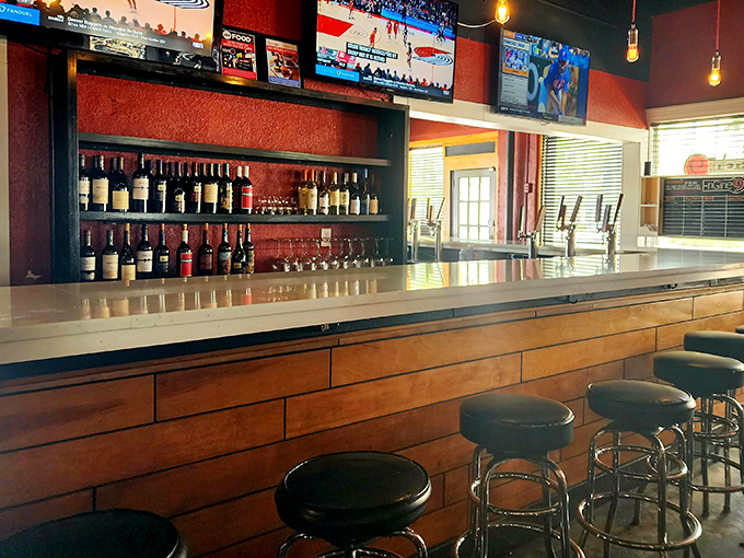 A well-stocked bar promises liquid refreshment to complement your burger adventure. Those stools have witnessed countless food epiphanies.