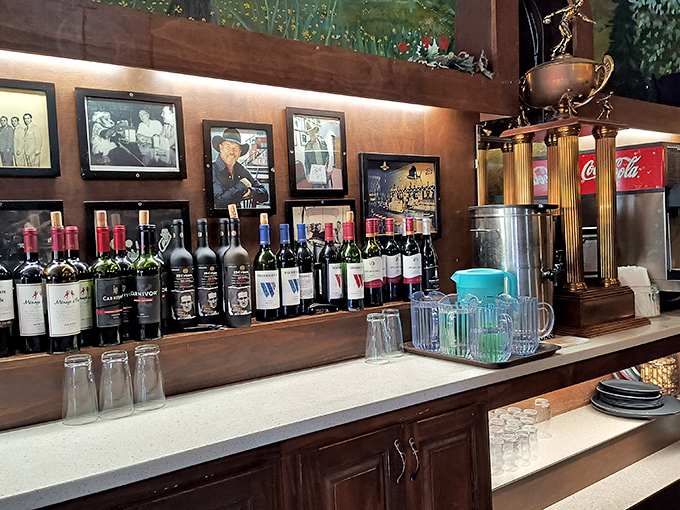 The bar area&mdash;where wine bottles stand at attention, ready to complement your carb-loading adventure with appropriate Italian dignity.