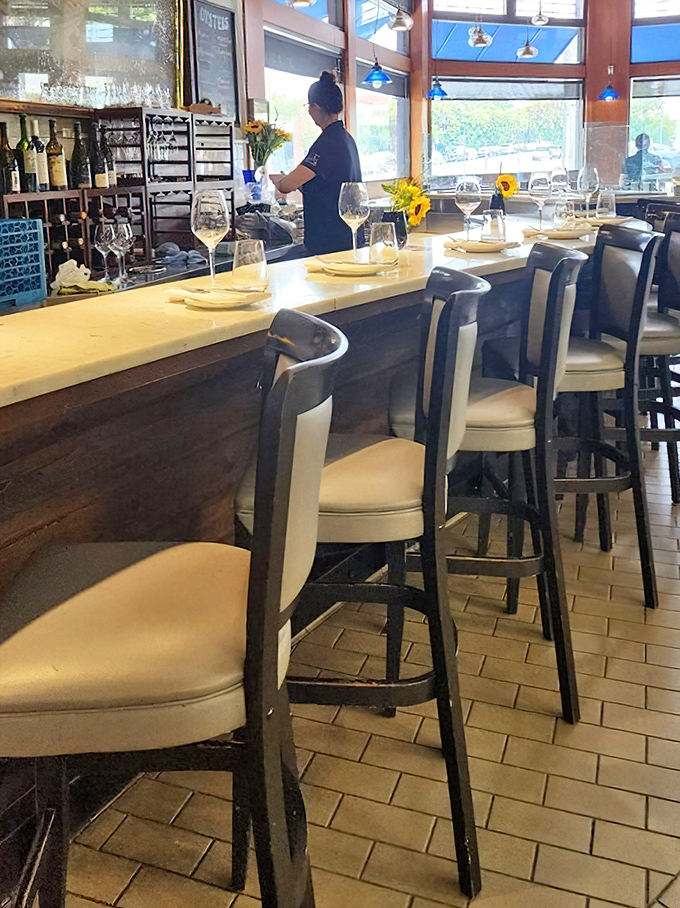 The bar where strangers become friends over oyster recommendations. Notice the sunflowers&mdash;nature's way of saying "order something yellow."