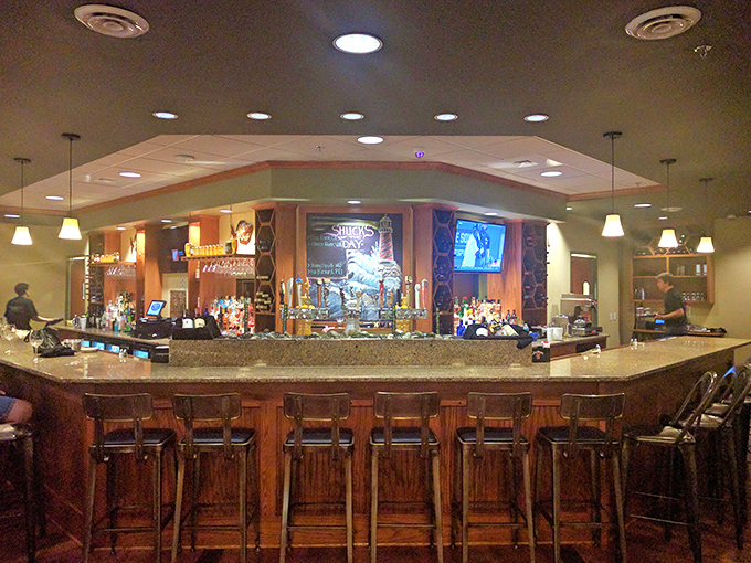 The bar at Youell's isn't just a place to wait for your table—it's a destination itself, with a selection that would make any coastal tavern proud.