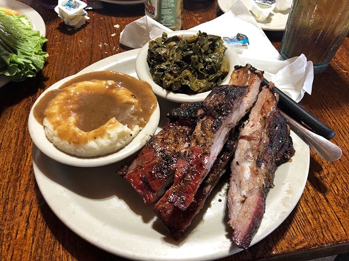 BBQ ribs with that perfect smoke ring, tender mashed potatoes, and collard greens&mdash;the holy trinity of Southern comfort on a plate.
