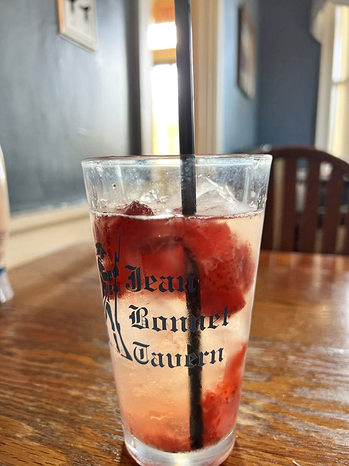 Even the beverages at Jean Bonnet Tavern come with a side of history, served in glasses that have seen more stories than your favorite bartender.