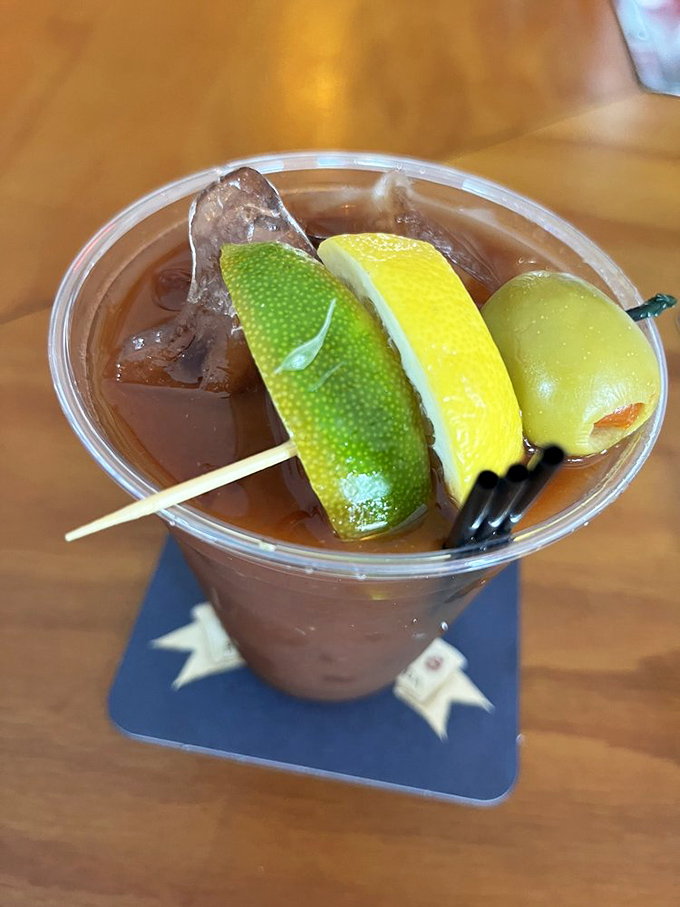 A perfectly garnished cocktail that screams "vacation mode activated." Three citrus slices means triple the fun in this pirate's paradise.