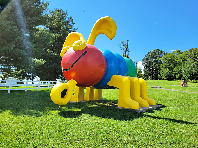 This cheerful, colorful critter stands guard outside, perhaps warning visitors: "The real wonders are below, but I'm pretty impressive too!"