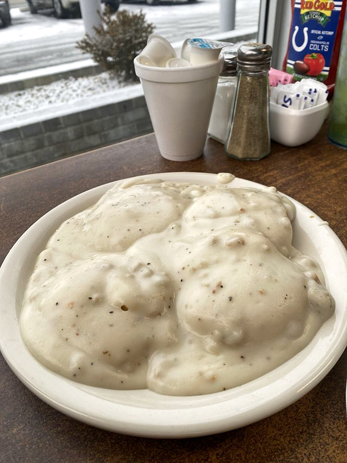 Biscuits and gravy that look like clouds floating in a sea of peppery sausage goodness &ndash; breakfast nirvana on a plate.