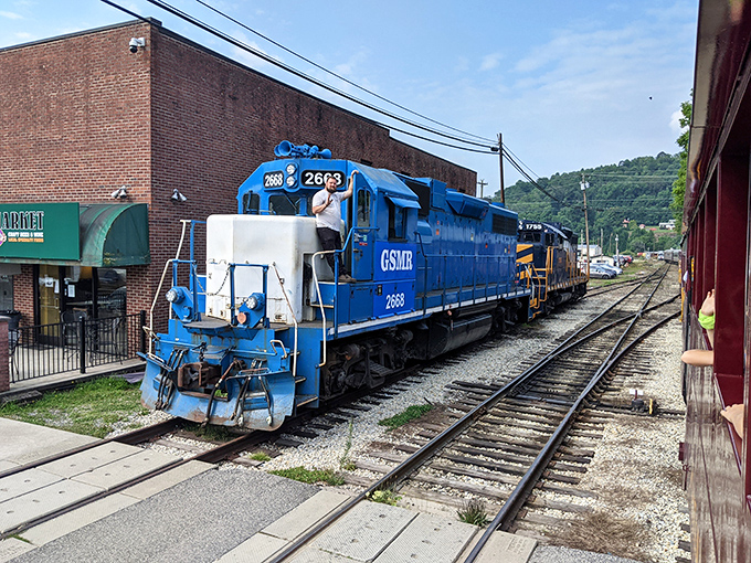 Blue skies and burgundy paint create a picture-perfect moment that belongs in a travel magazine.