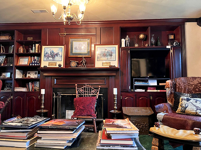 The library offers literary escape with walls of books and a fireplace that practically begs you to curl up with a classic novel.