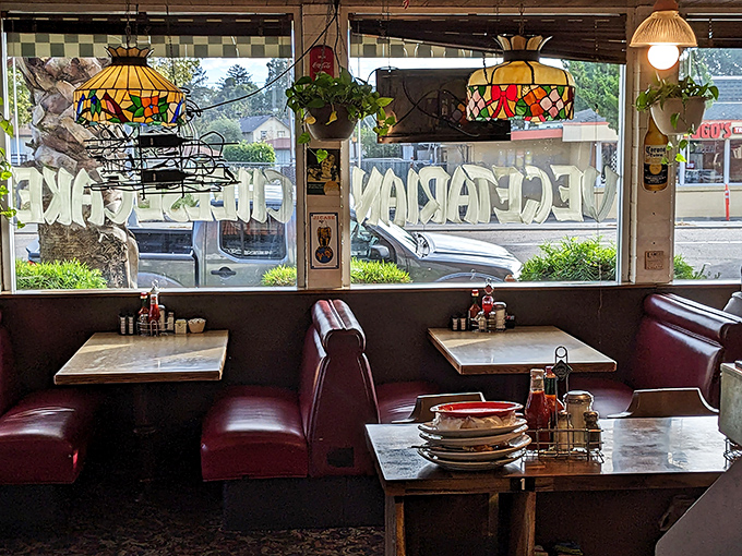 Stained glass lamps cast a warm glow over booths that have hosted first dates, family reunions, and countless "we need to talk" conversations.