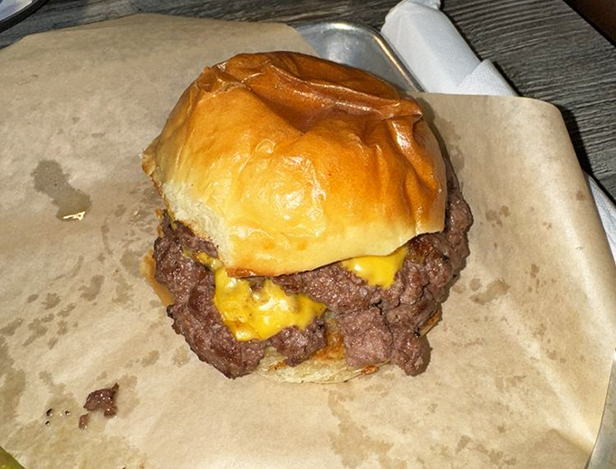 This isn't just a burger&mdash;it's a monument to the art of beef. The melted cheese cascading down the sides suggests this is serious comfort food territory.