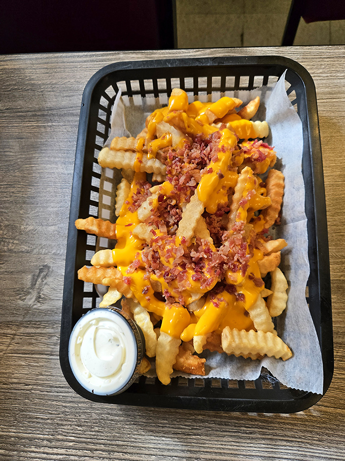 Loaded fries that require both a fork and a strategy&mdash;each bite delivering the perfect ratio of crispy potato, melty cheese, and bacon bits.