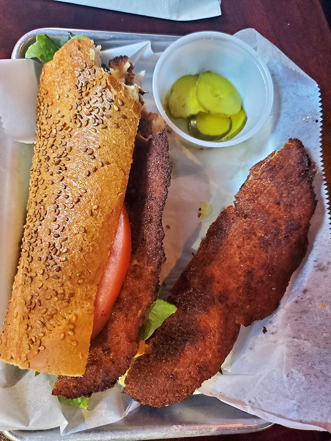 The chicken cutlet sandwich &ndash; where breaded perfection meets fresh vegetables in a handheld masterpiece that puts desk lunches everywhere to shame.