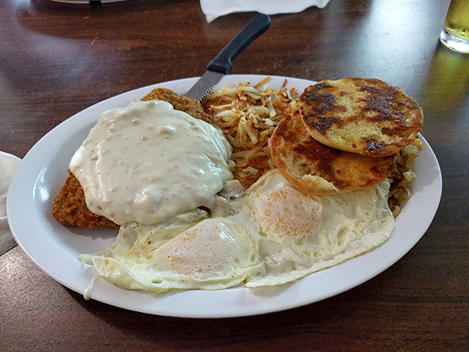 Chicken fried steak smothered in gravy with a side of pancakes&mdash;because sometimes you need to embrace the beautiful marriage of breakfast and dinner.