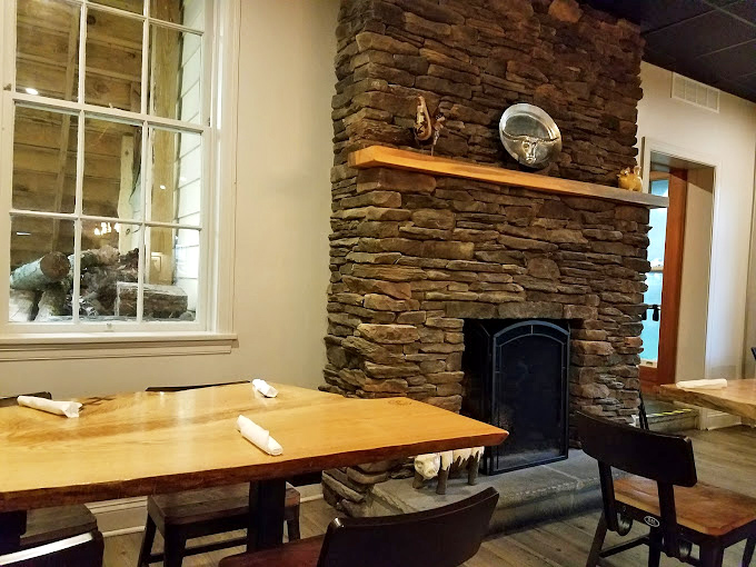 That stone fireplace isn't just decoration&mdash;it's a monument to the primal connection between fire, stone, and perfectly smoked meat.