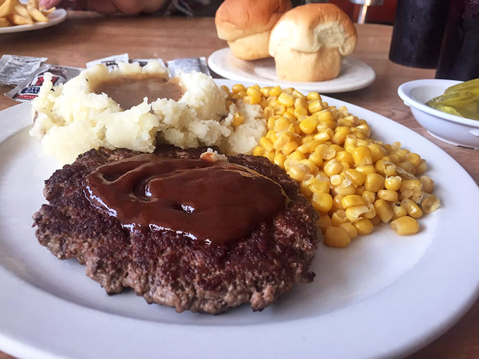 The classic chopped steak platter&mdash;when your stomach demands substance and your soul craves comfort. Those mashed potatoes aren't just a side, they're a statement.