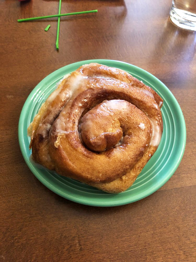 This cinnamon roll isn't just breakfast&mdash;it's an edible hug, swirled with cinnamon and glazed with enough sweetness to justify morning dessert.