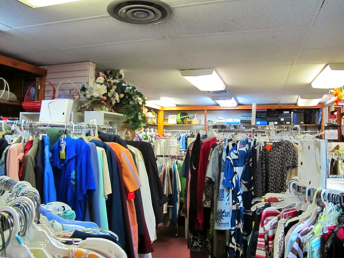 The rainbow of possibilities hanging neatly in rows. Each garment a character waiting for its next chapter.