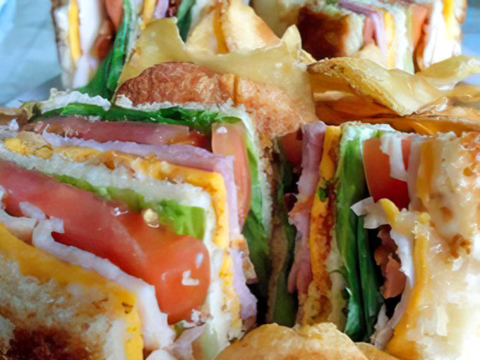 This towering sandwich construction project delivers architectural excellence you can actually sink your teeth into.