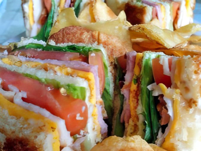 This towering sandwich construction project delivers architectural excellence you can actually sink your teeth into.